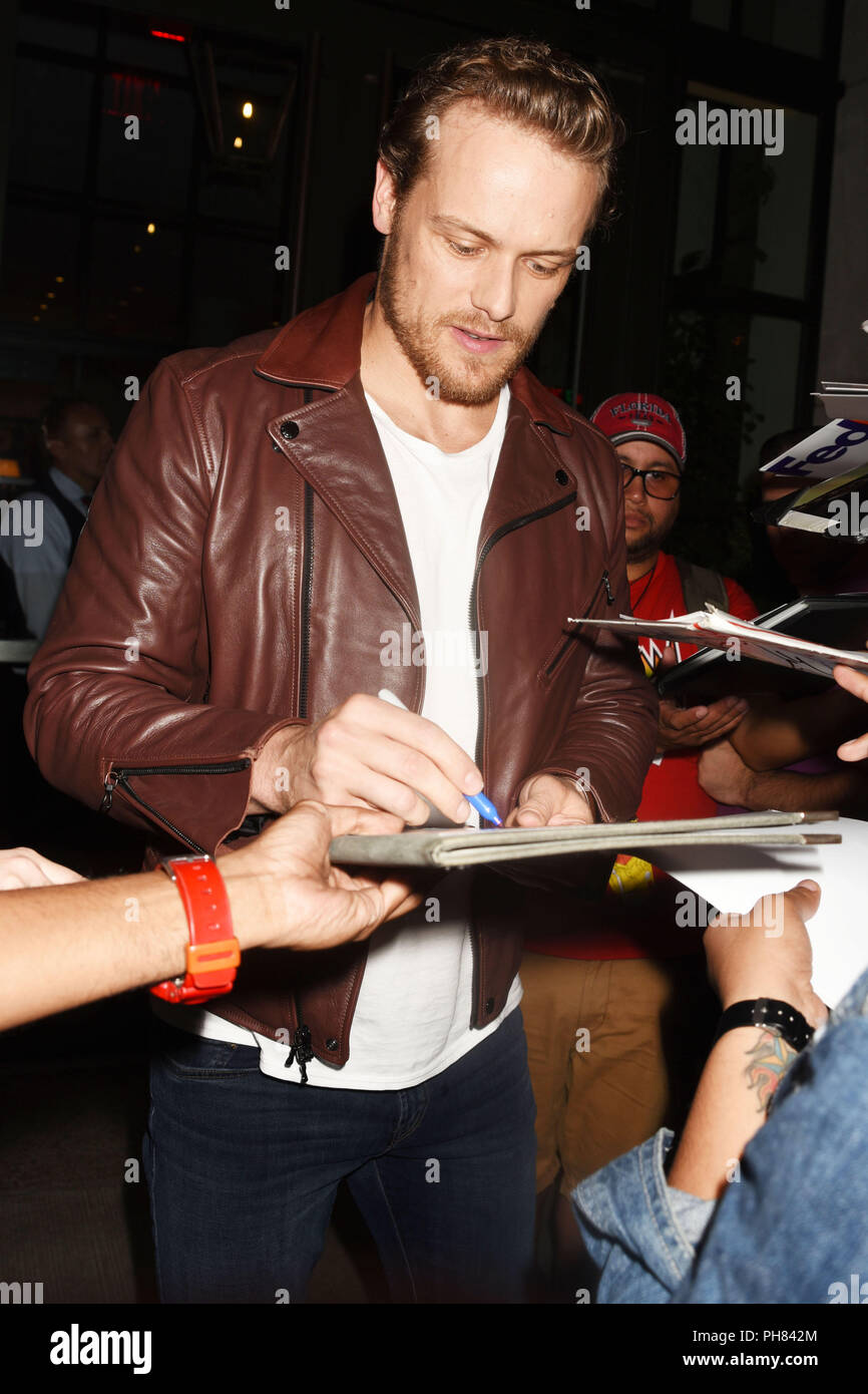 Sam Heughan signing autographs for fans outside his hotel in New York ...