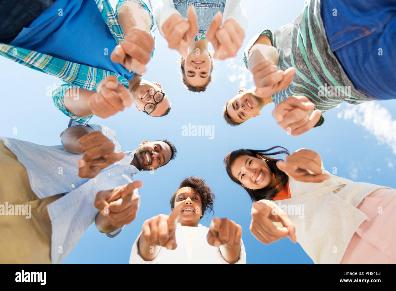 happy friends pointing at you standing in circle Stock Photo - Alamy