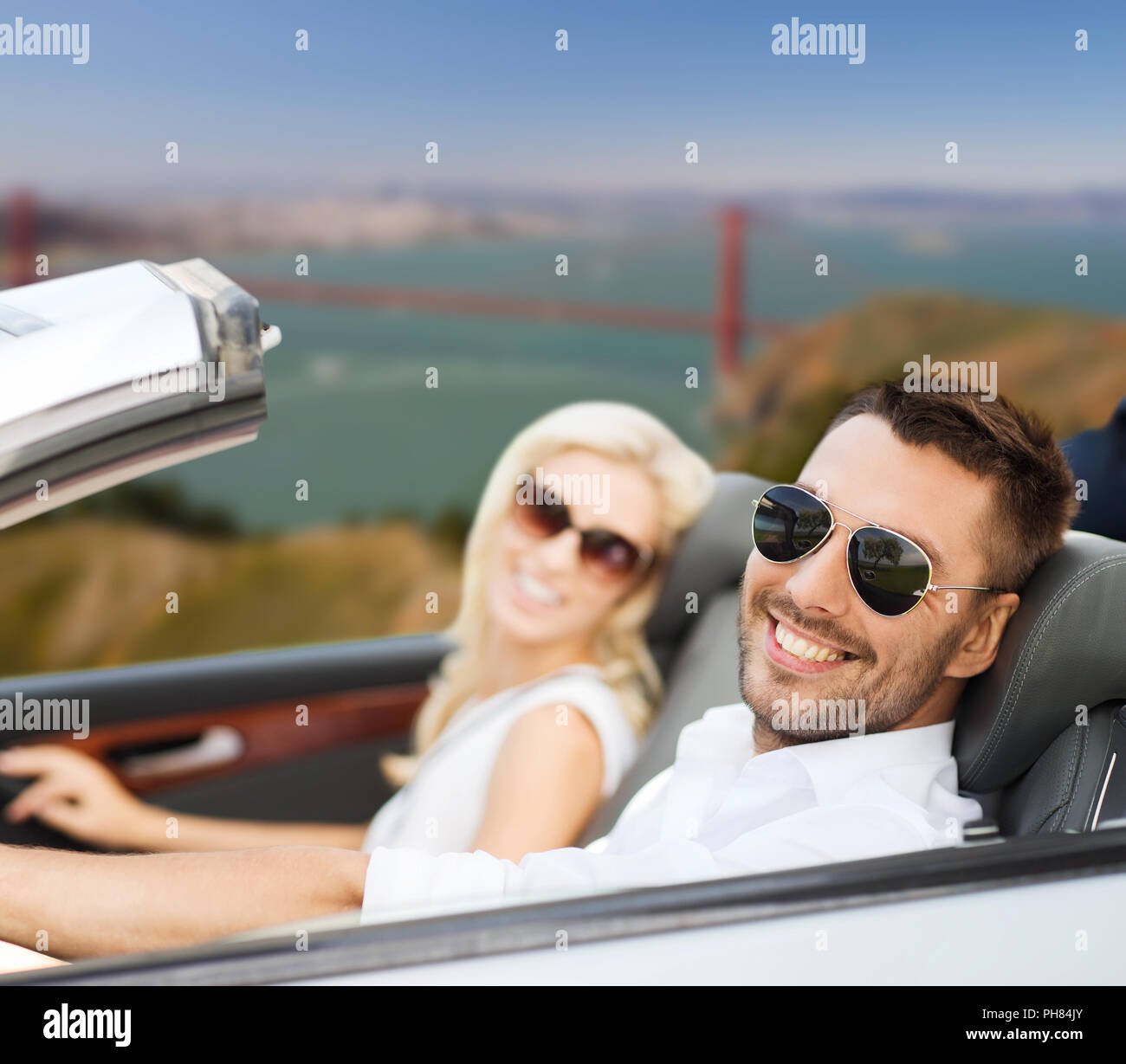 happy couple driving in convertible car Stock Photo - Alamy
