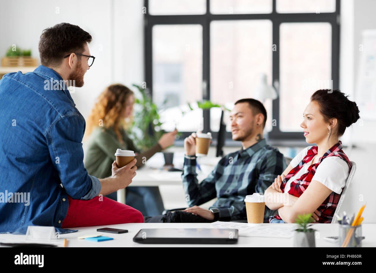 creative team drinking coffee at office Stock Photo - Alamy