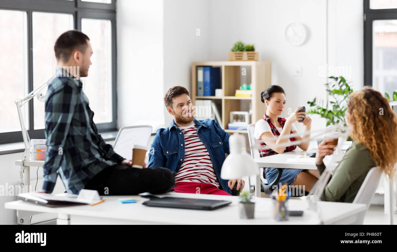 Business team drinking coffee talking hi-res stock photography and ...