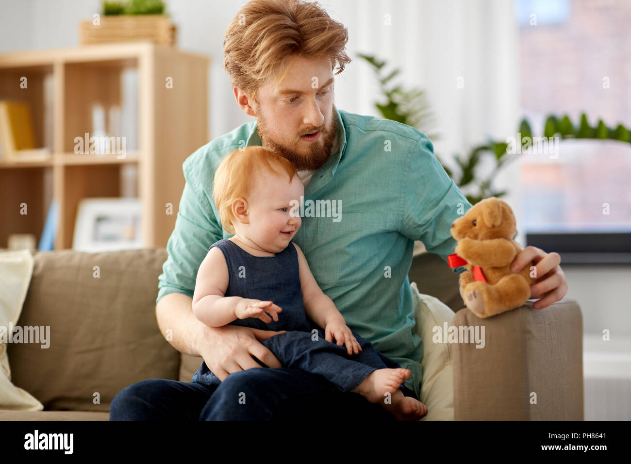 father and baby daughter with teddy bear at home Stock Photo - Alamy