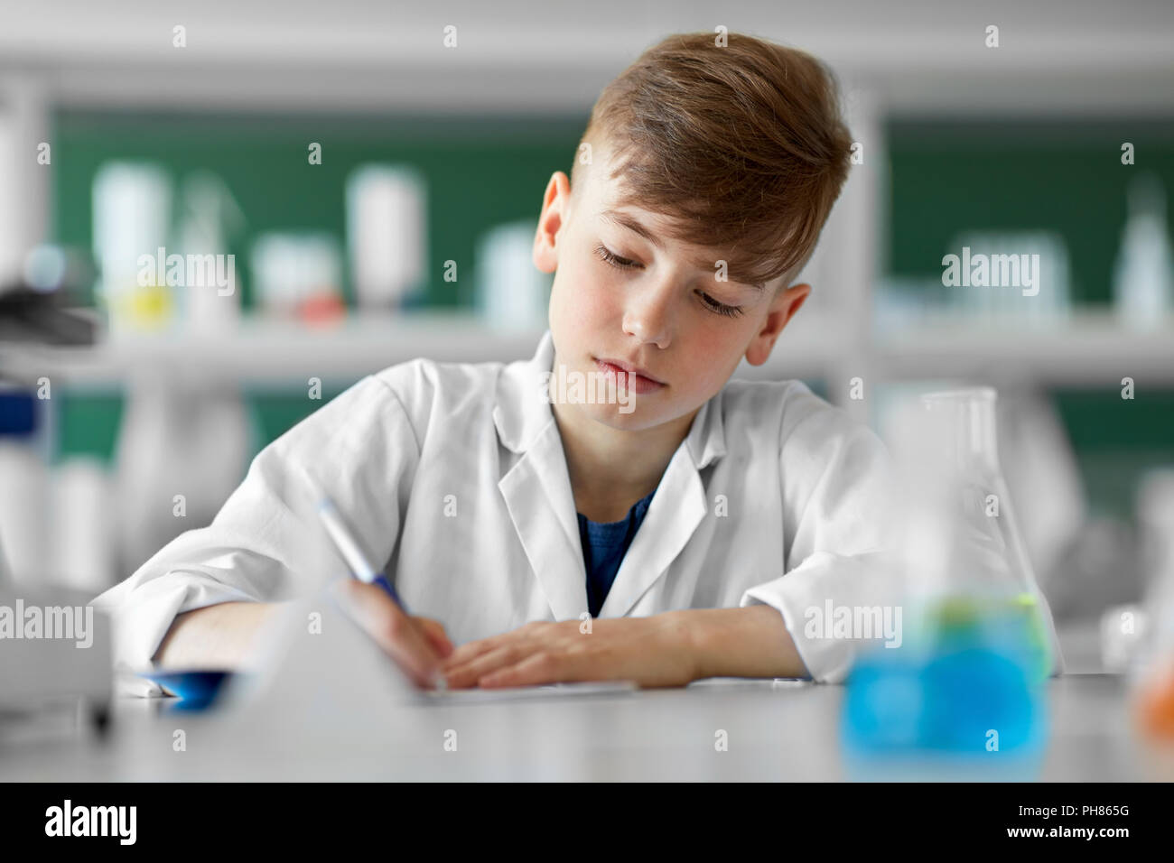 boy with notebook studying biology at school Stock Photo - Alamy