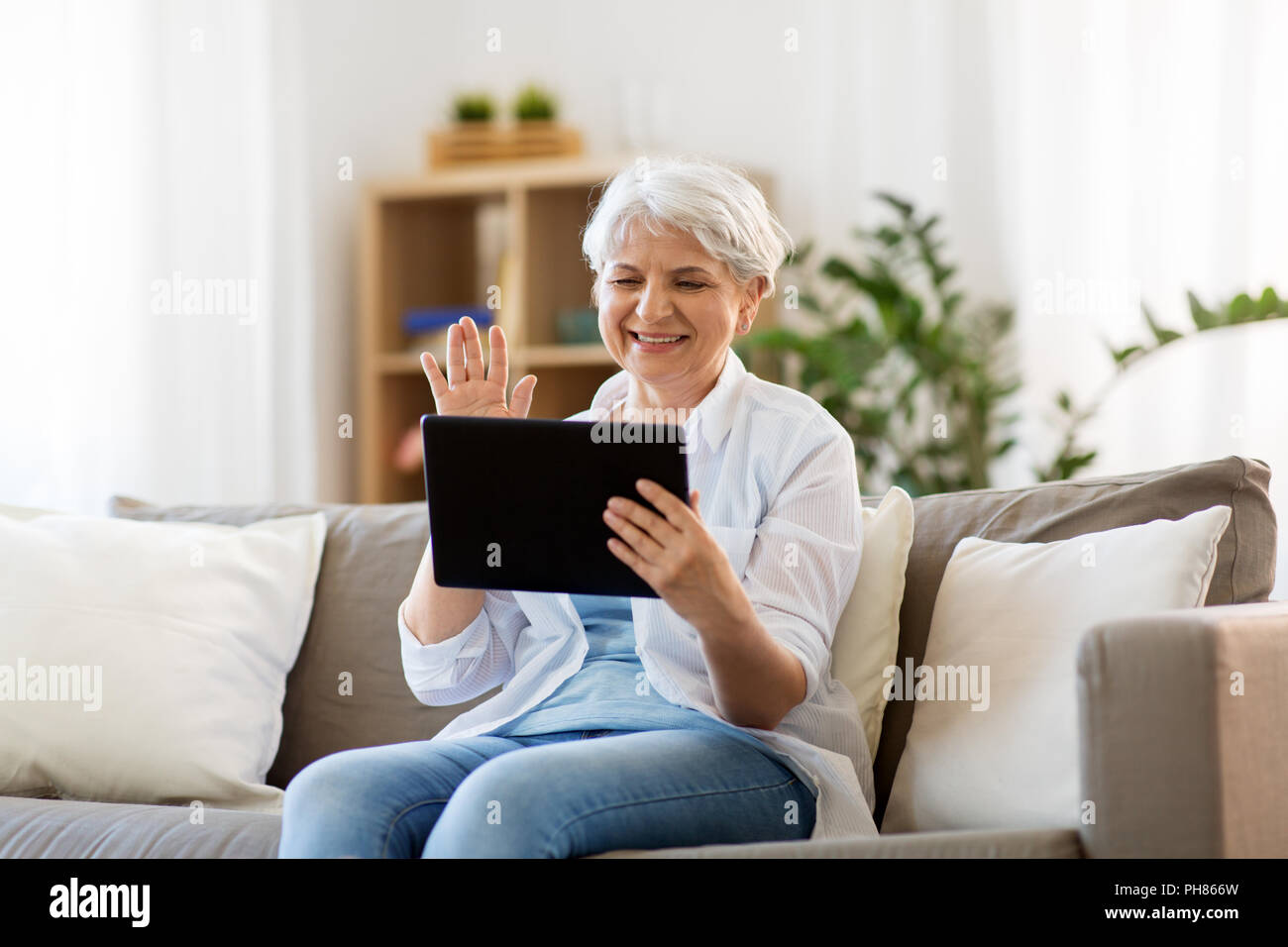 Senior woman talking video chat hi-res stock photography and images - Alamy