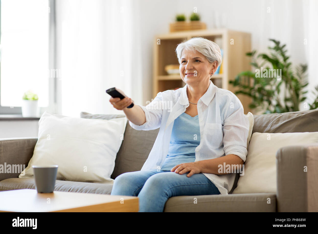 Old woman watching television High Resolution Stock Photography and ...