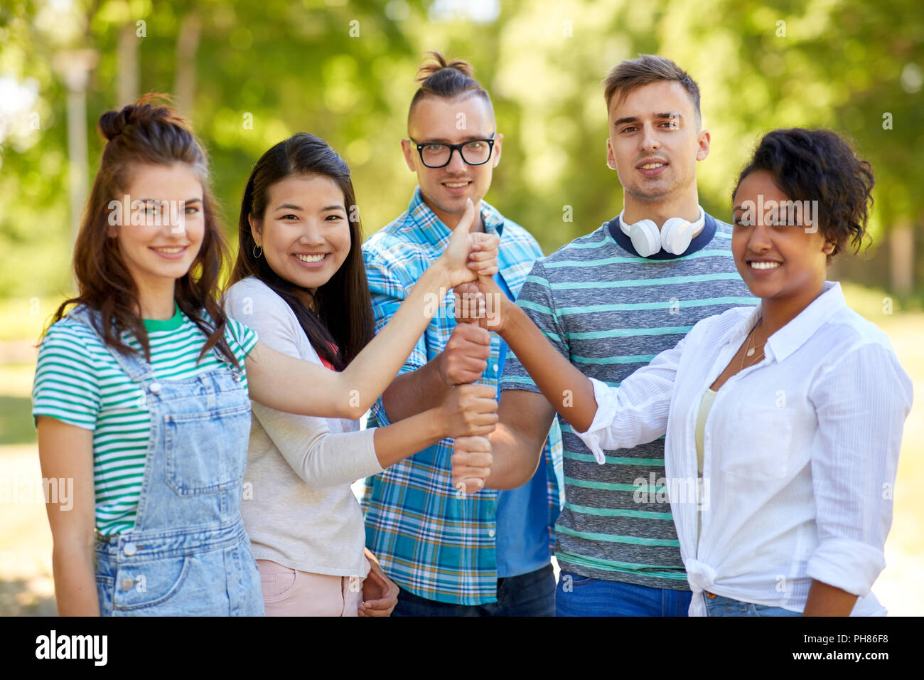 Group friends success thumbs hi-res stock photography and images - Alamy
