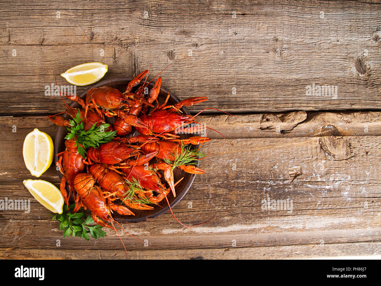 Boiled cooked crayfish crawfish ready to eat onold rustic wooden ...