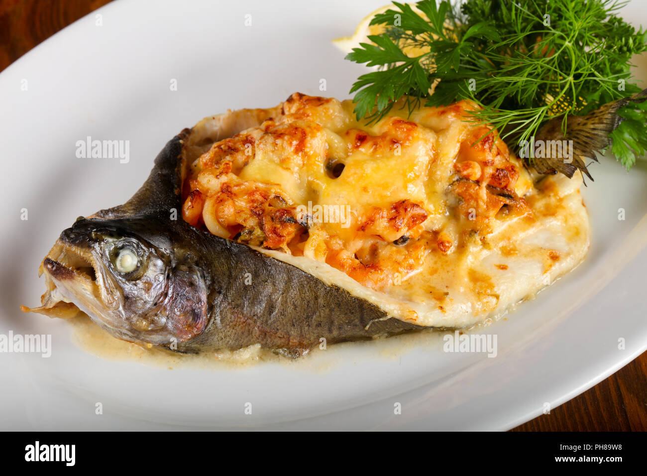 Stuffed trout with cheese Stock Photo - Alamy