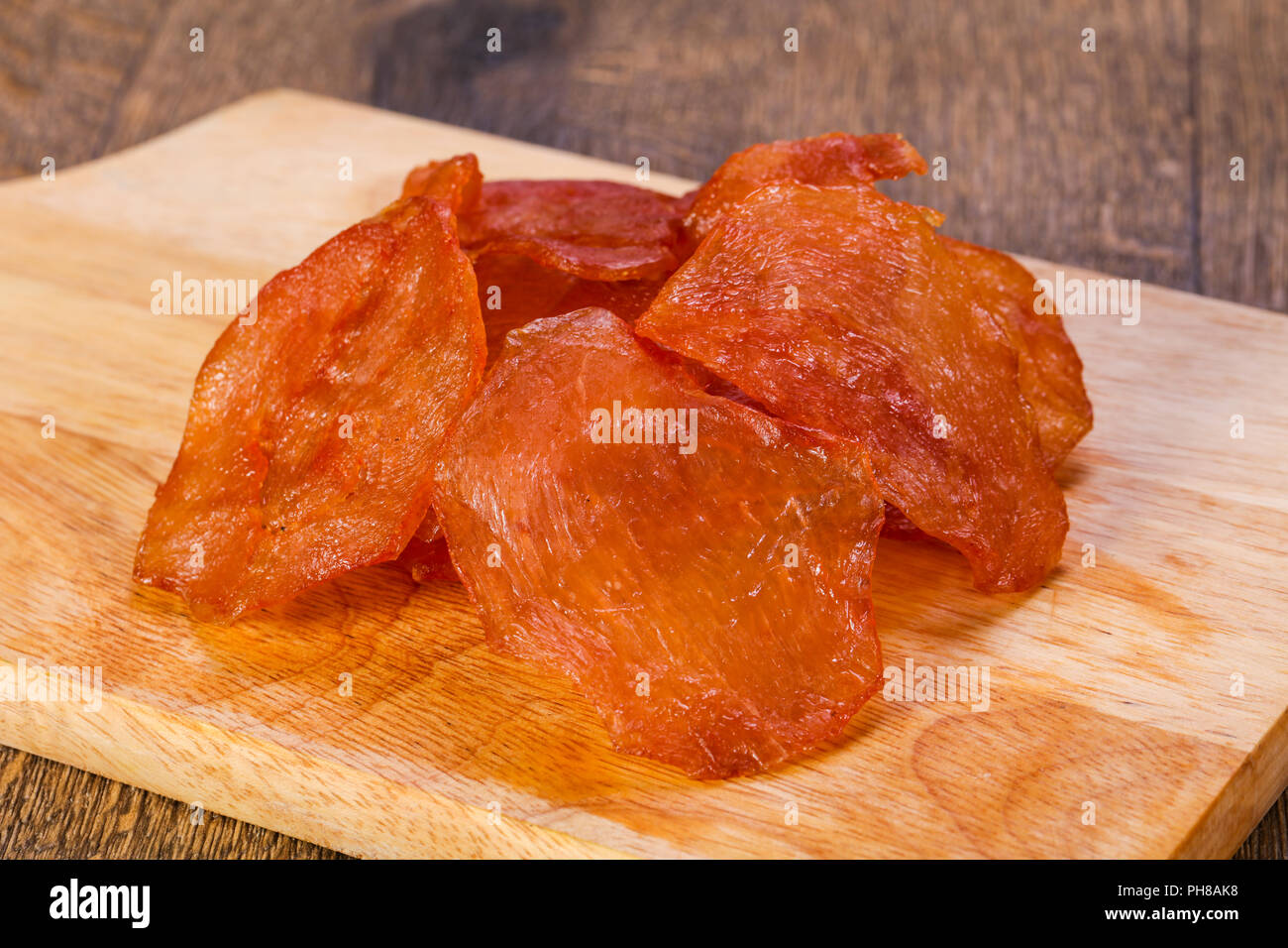 Dry chicken meat over wooden Stock Photo - Alamy
