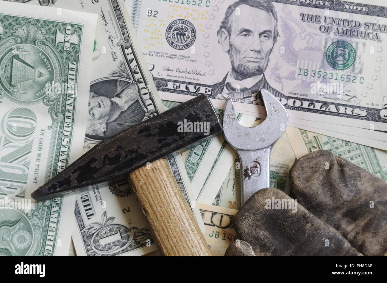 Tools with dollar banknotes Stock Photo - Alamy