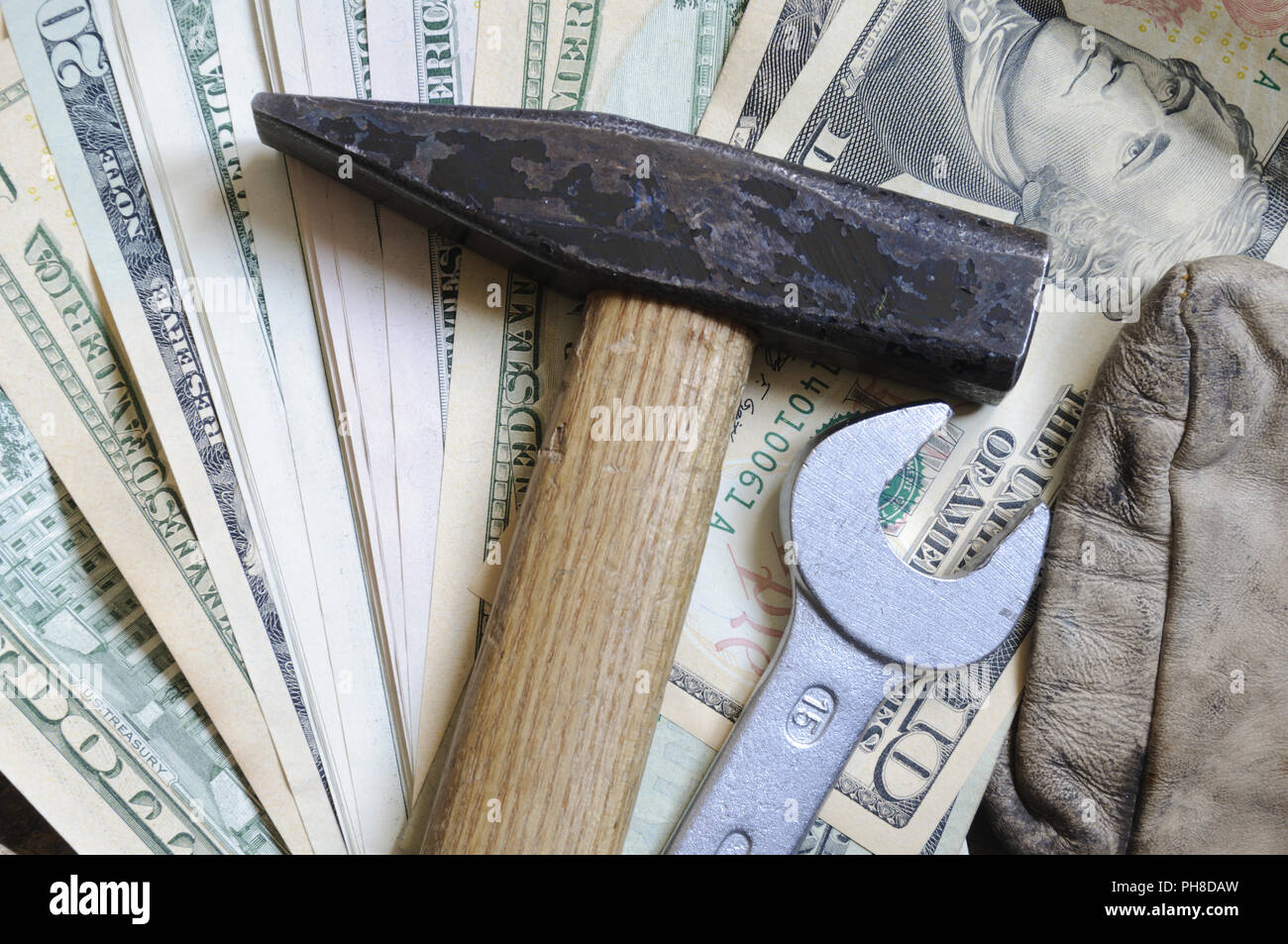 Tools with dollar banknotes Stock Photo - Alamy