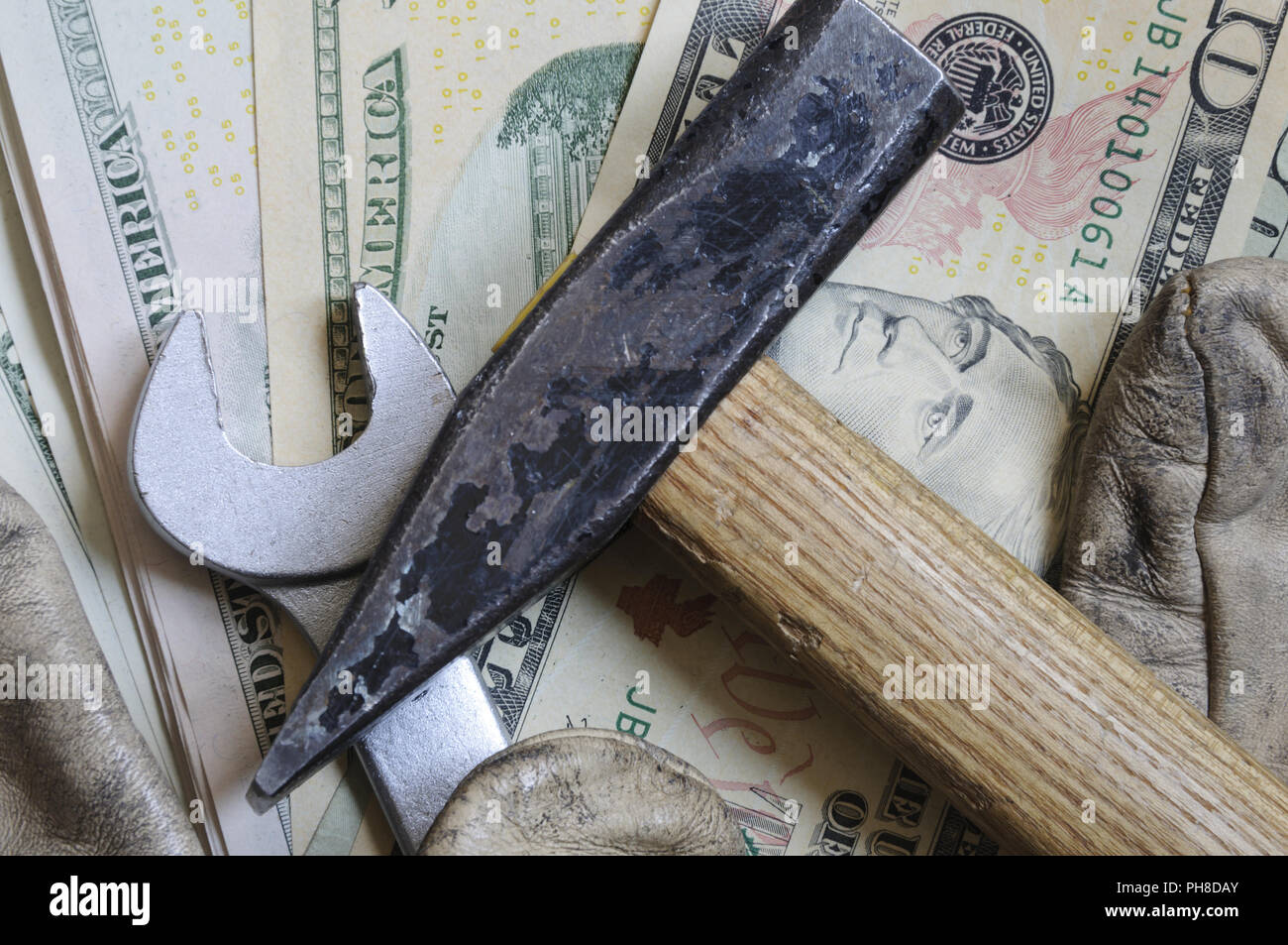 Tools with dollar banknotes Stock Photo - Alamy