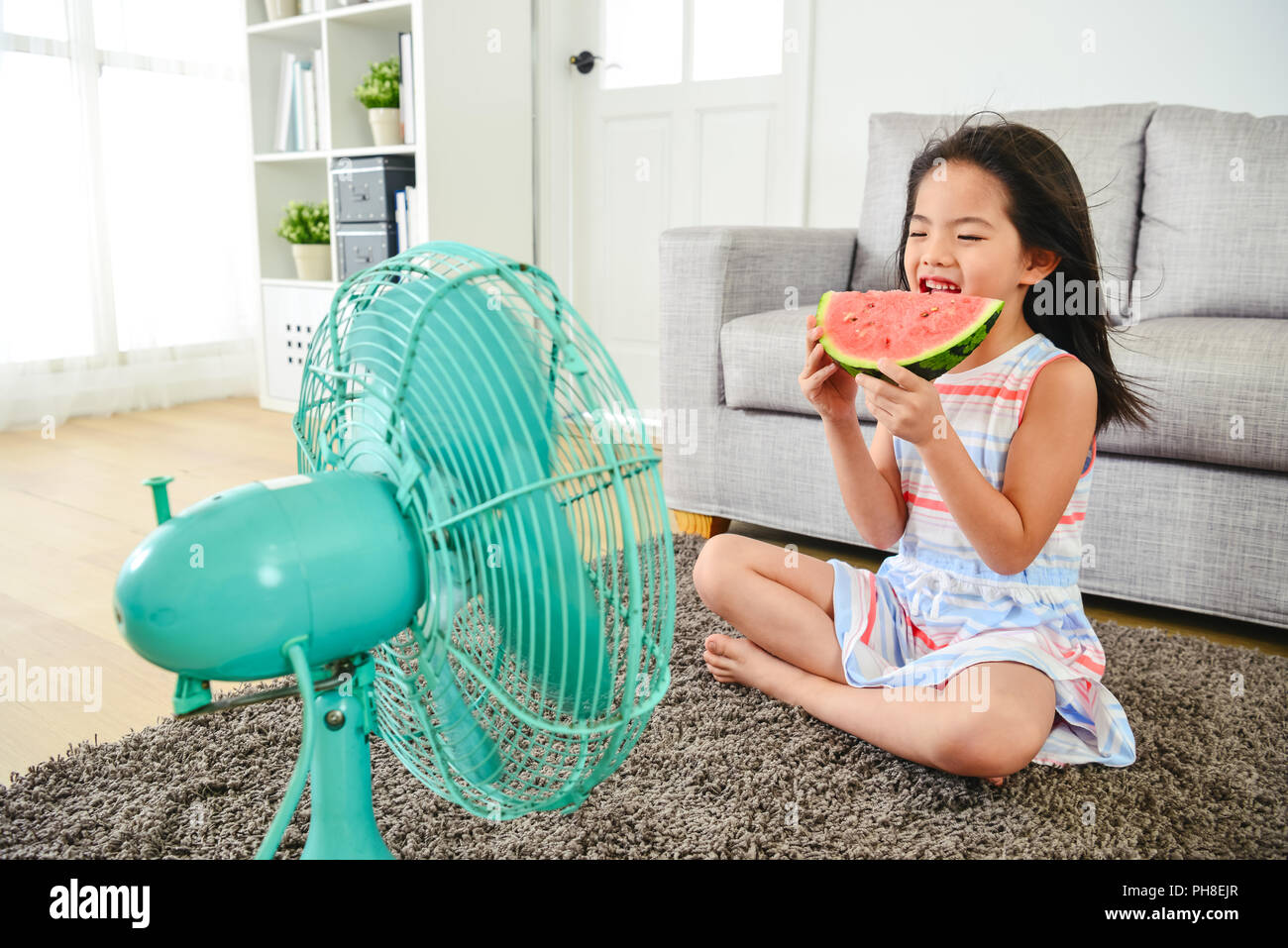 Woman Sitting In Front Of An Electric Fan Stock Photos & Woman Sitting ...