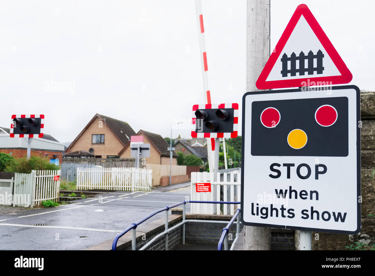 Stop when lights show at train rail crossing Stock Photo - Alamy