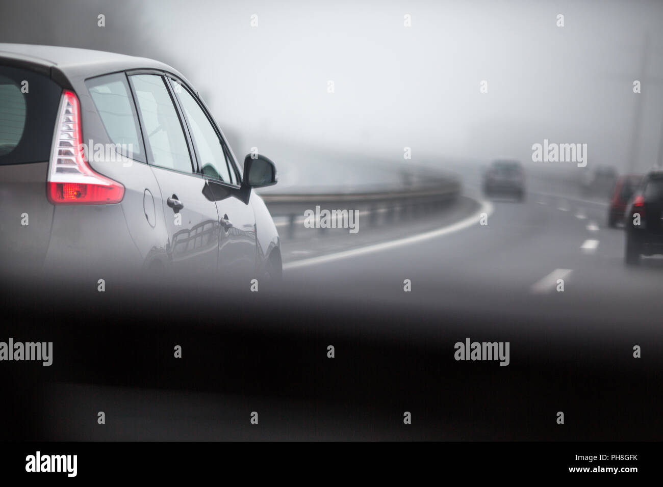 Cars going fast on a highway Stock Photo - Alamy