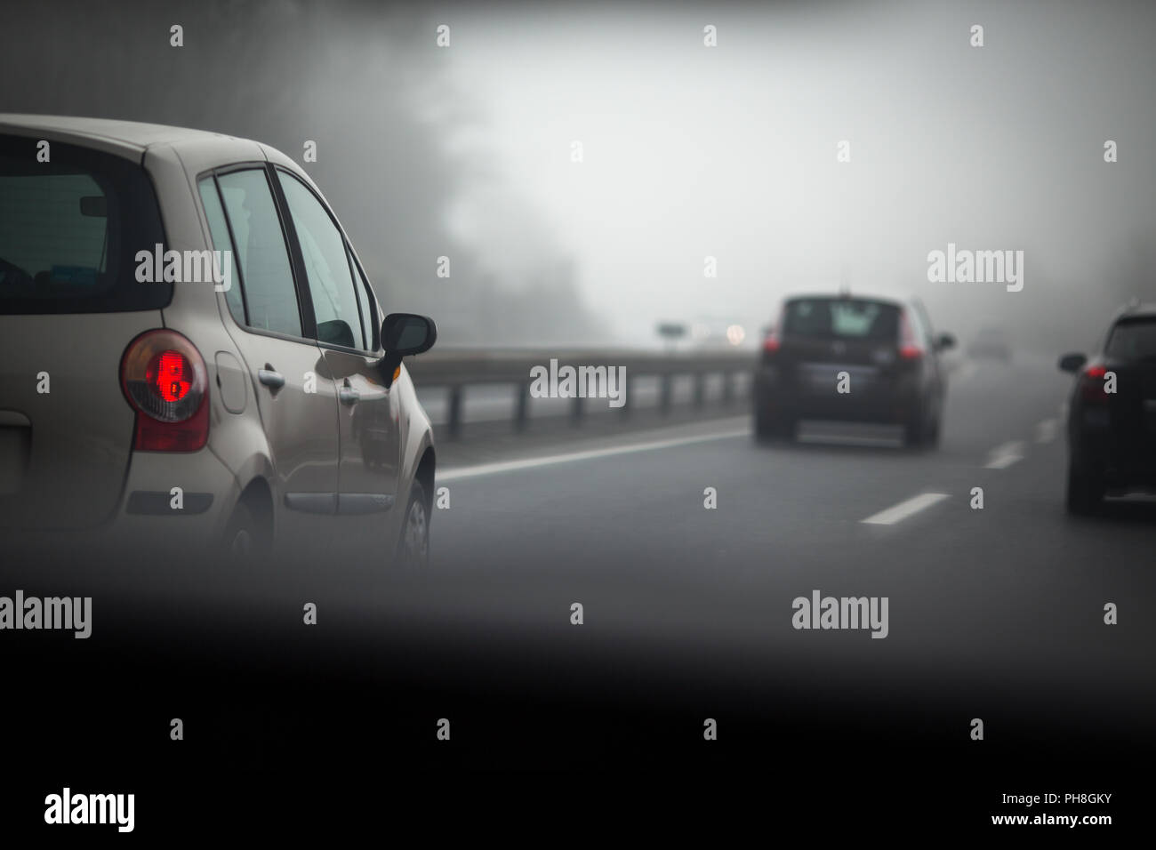 Cars going fast on a highway Stock Photo - Alamy