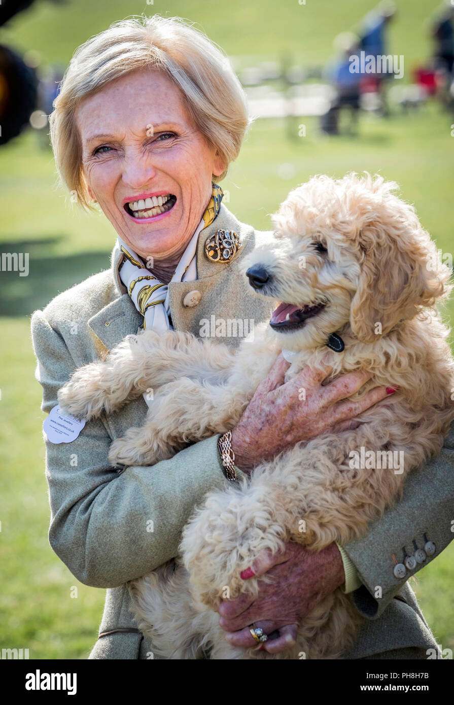 Country Fair President Mary Berry holds a dog called Henry during the ...