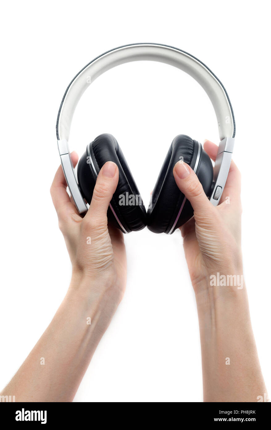 headphones in hands Stock Photo - Alamy