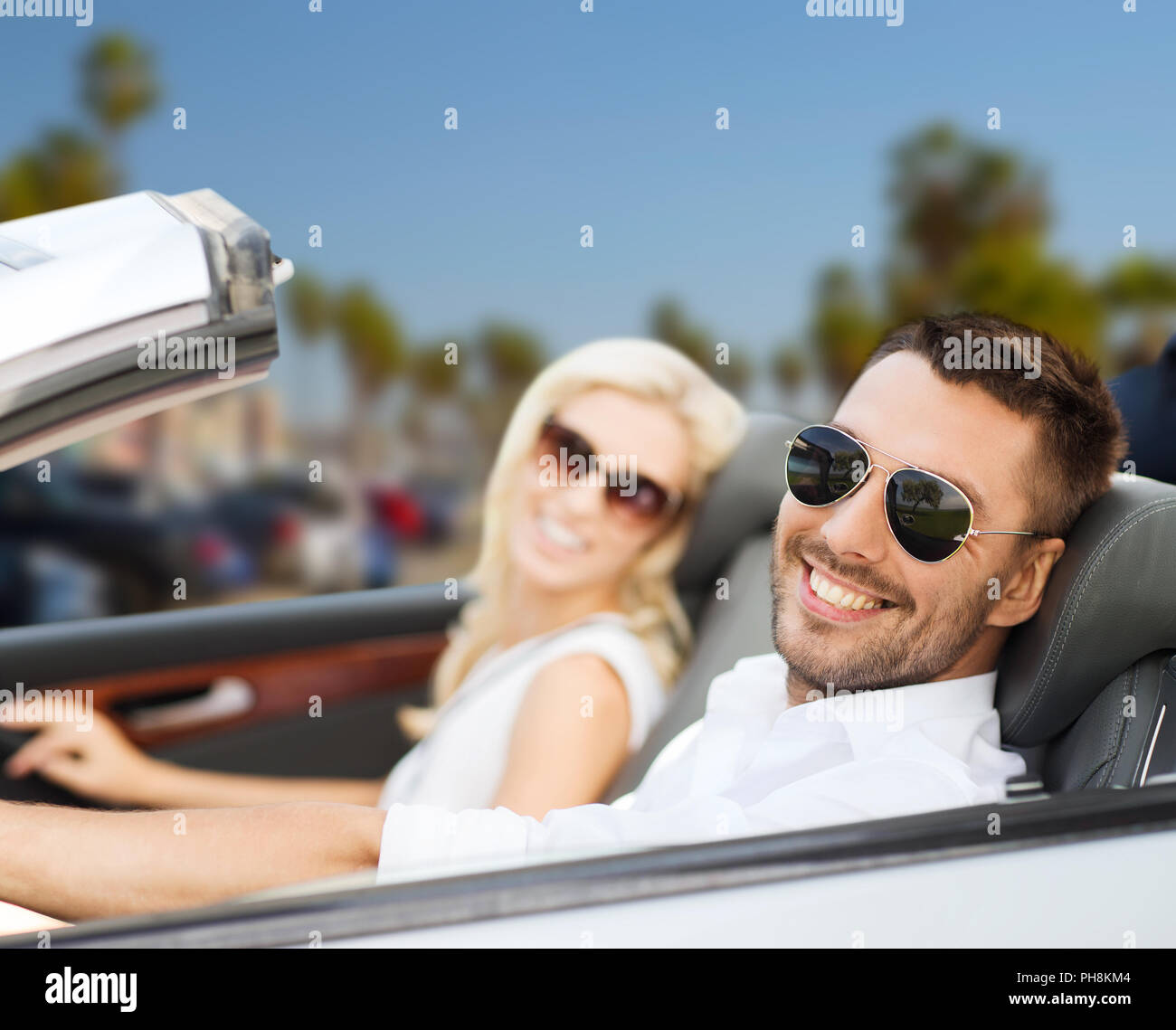 Driving convertible smiling couple beach hi-res stock photography and ...