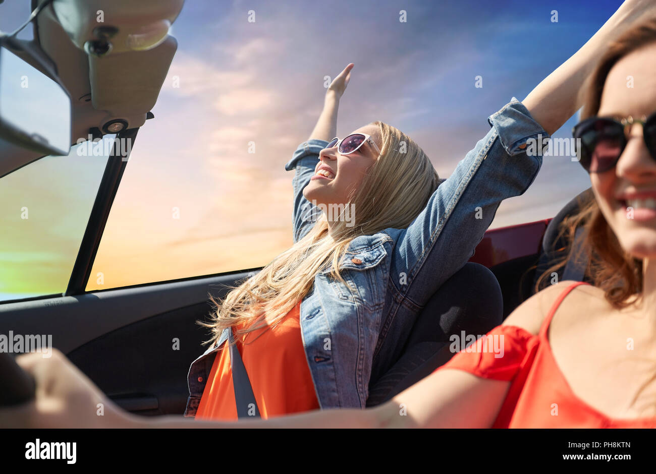 happy young women driving in convertible car Stock Photo - Alamy