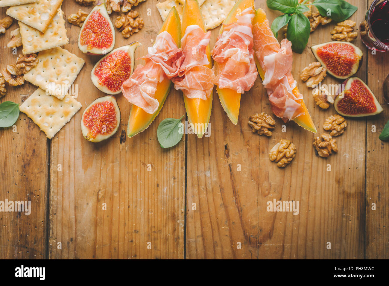 Tasty spanish mediterranian appetizers on old board on vintage wooden ...