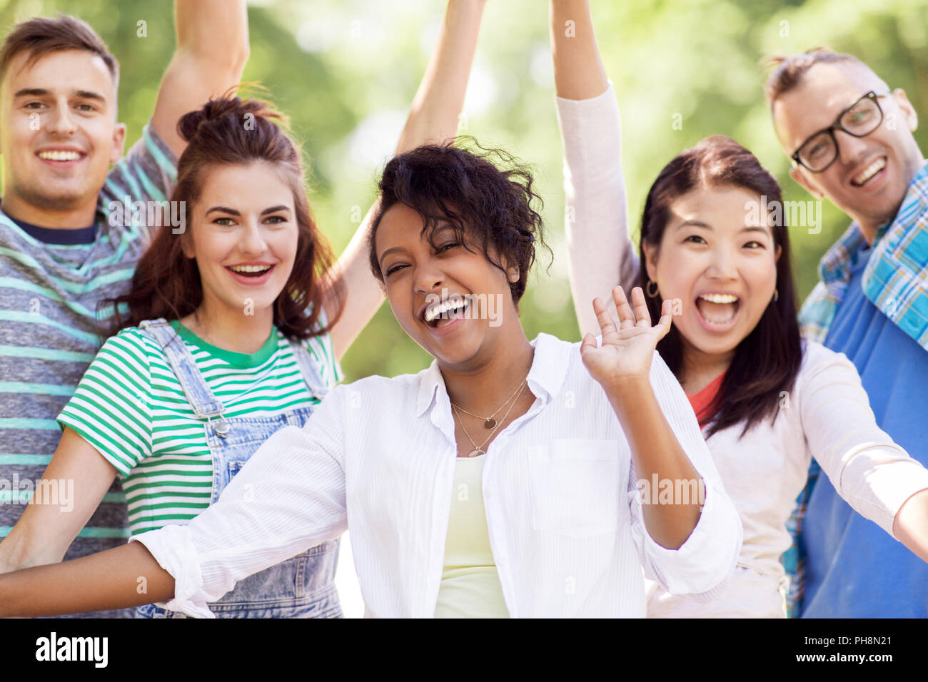 group of happy smiling friends having fun outdoors Stock Photo - Alamy