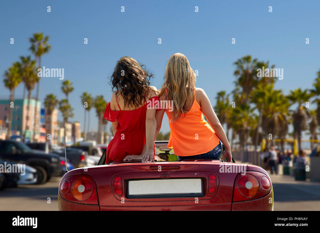 friends driving in convertible car at venice beach Stock Photo - Alamy