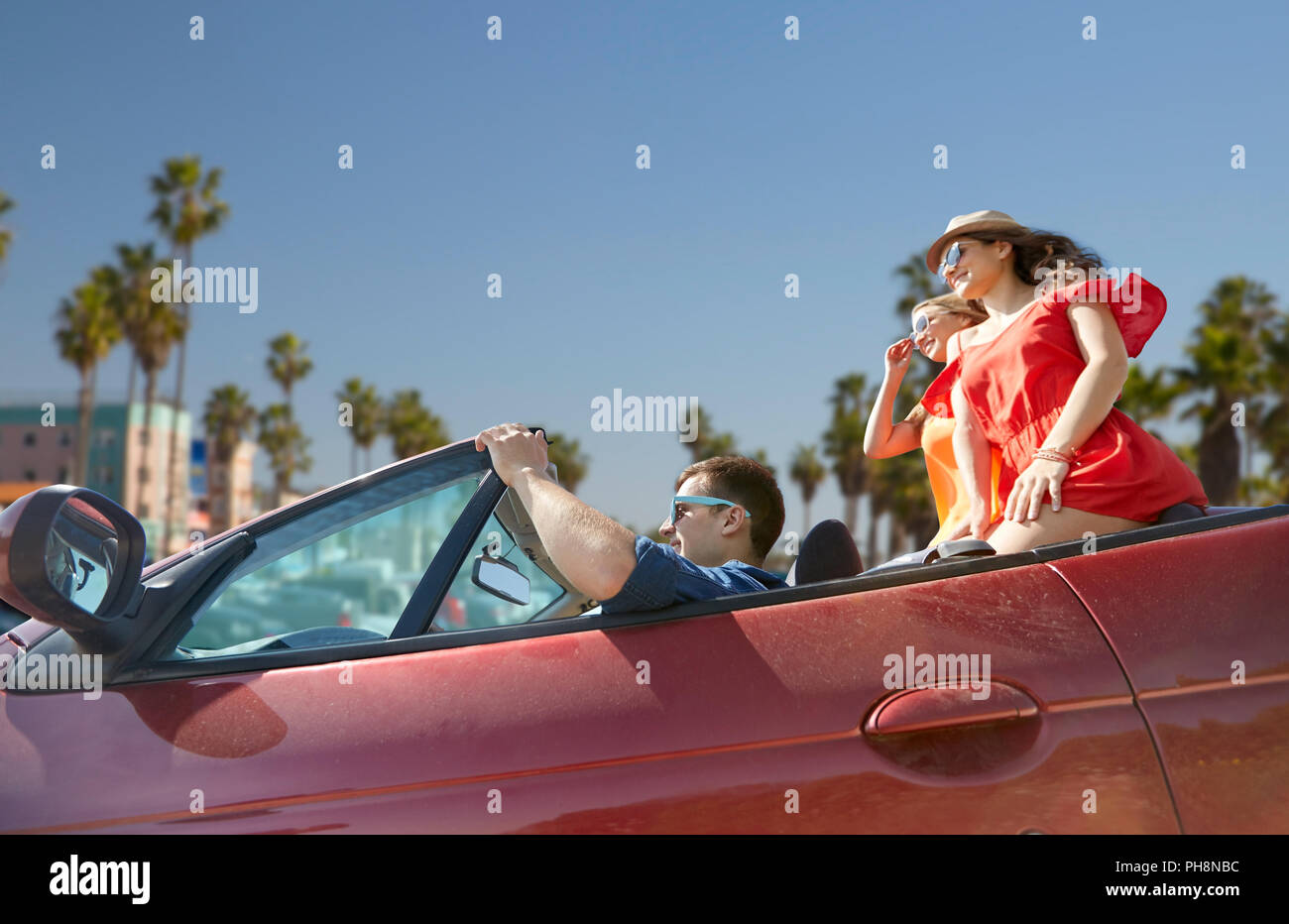 friends driving in convertible car at venice beach Stock Photo - Alamy