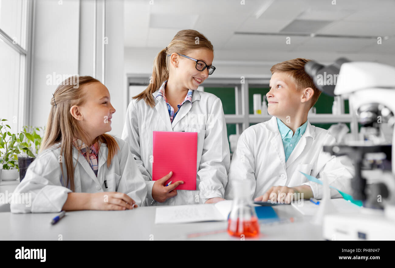 kids studying chemistry at school laboratory Stock Photo - Alamy