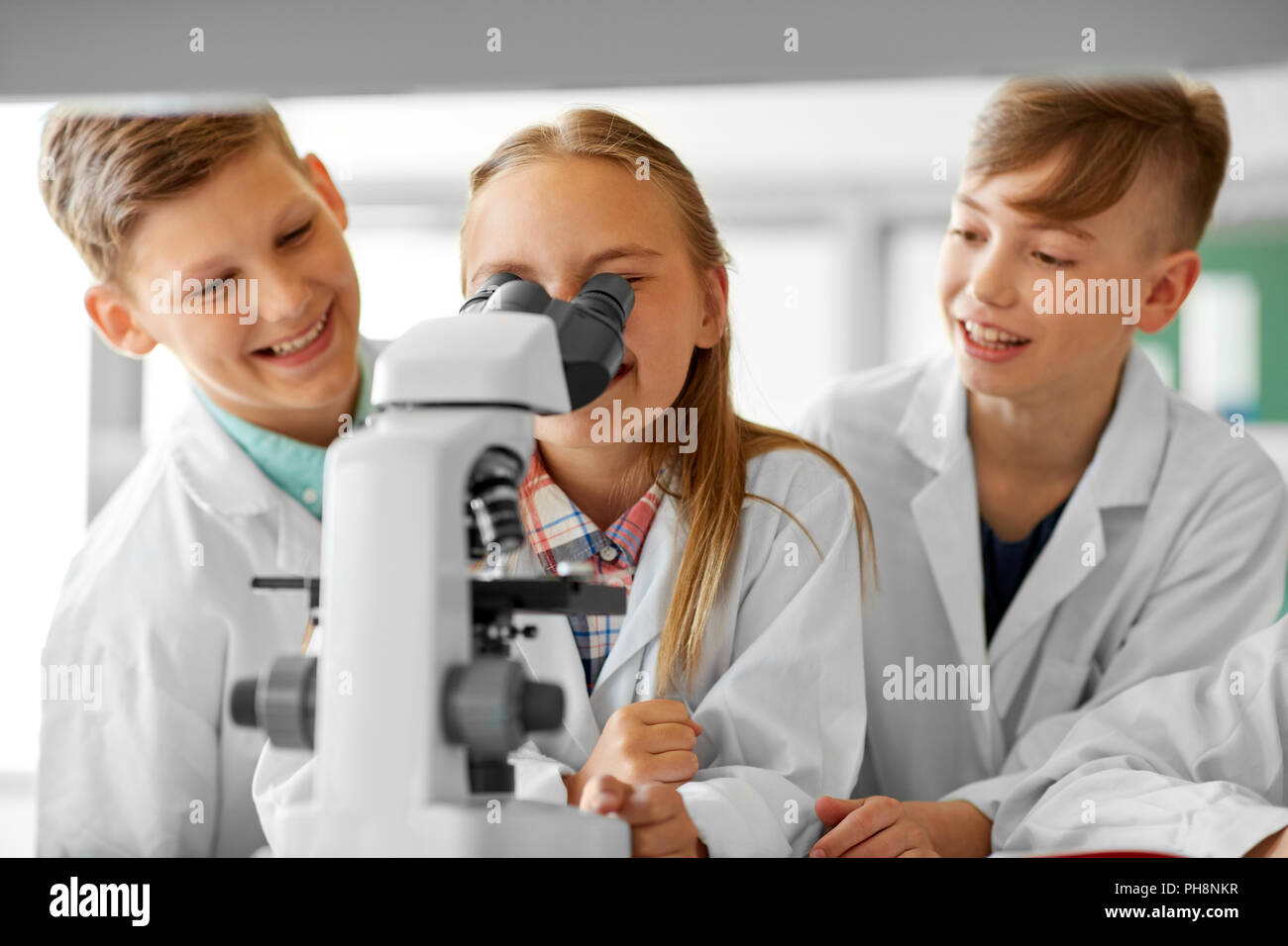 Student smiling microscope hi-res stock photography and images - Alamy