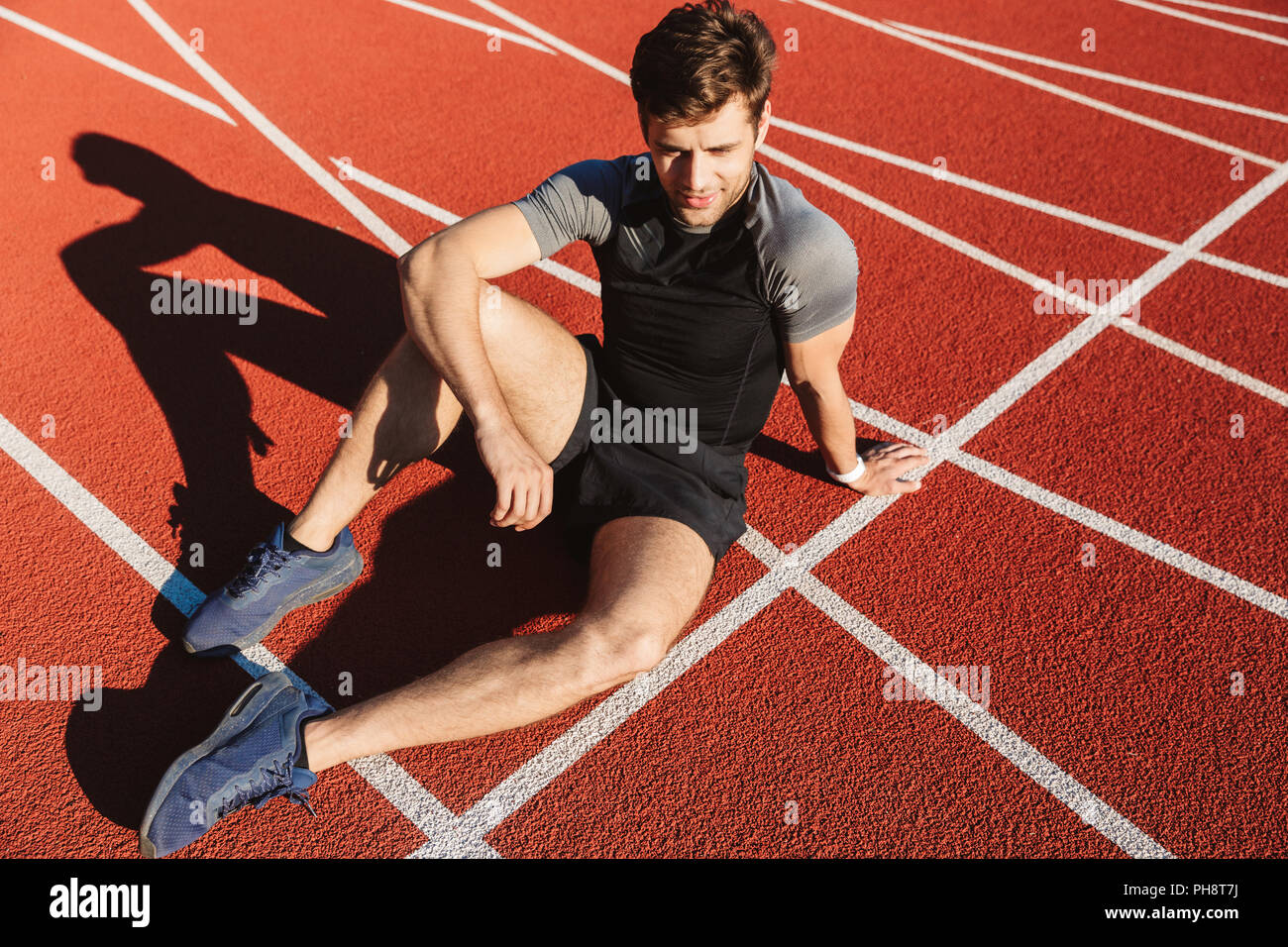 Exhausted sportsman finished running hi-res stock photography and ...