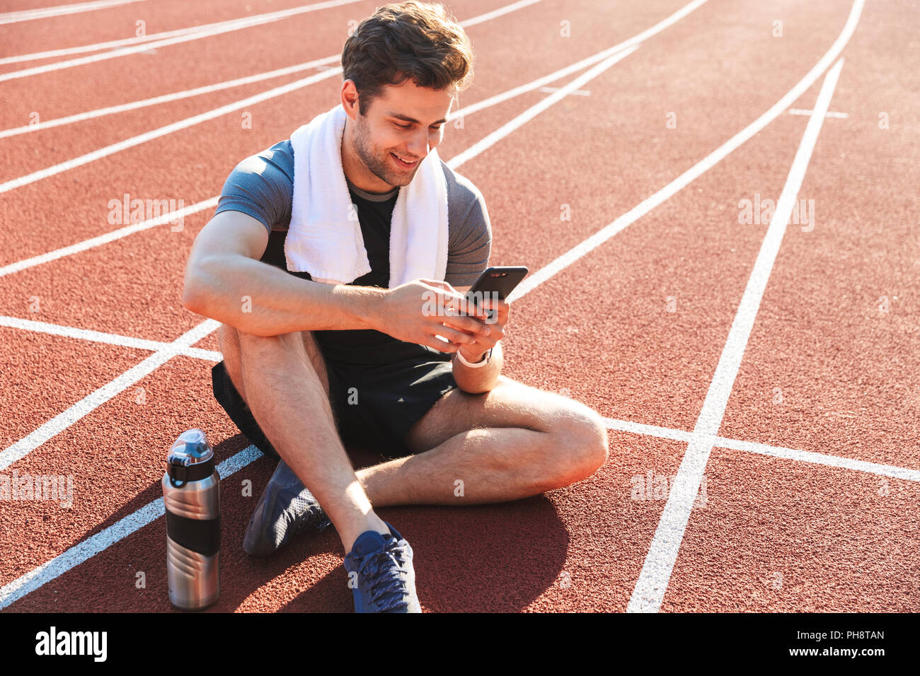 Man running outdoors using smart hi-res stock photography and images ...