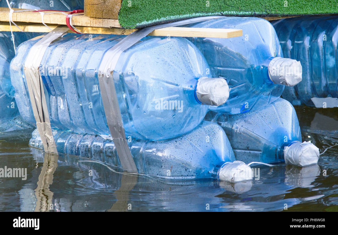 rafts made of recycled plastic bottels to teach reuse Stock Photo - Alamy