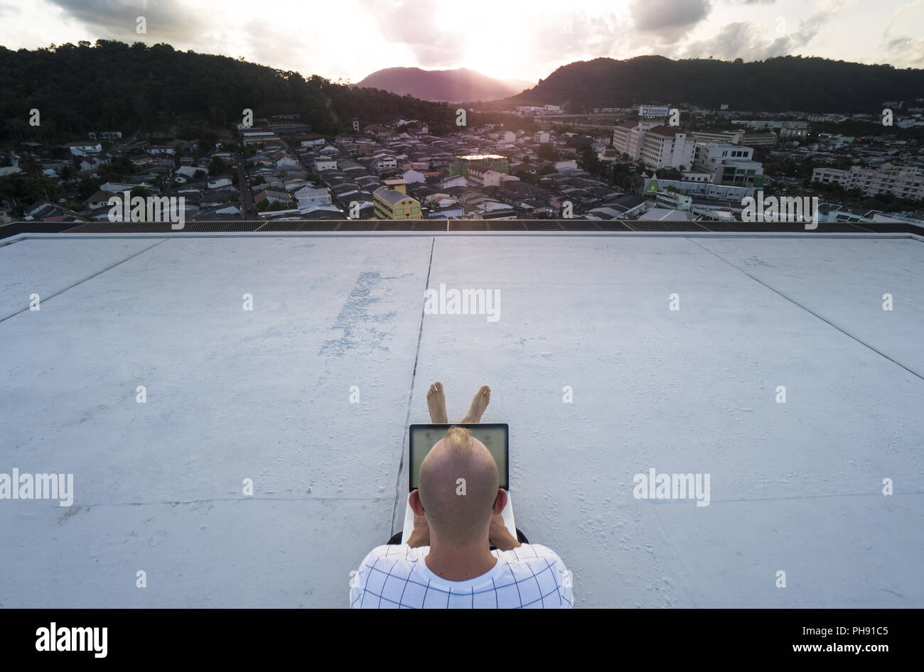 Rooftop man hi-res stock photography and images - Alamy