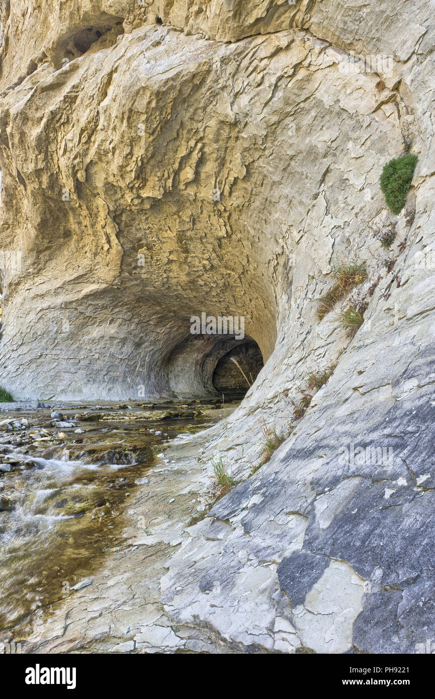 Entrance of an underground river Stock Photo - Alamy