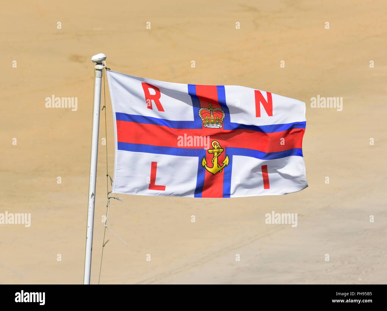 Royal National Lifeboat Institution flag,RNLI ensign flag against a ...
