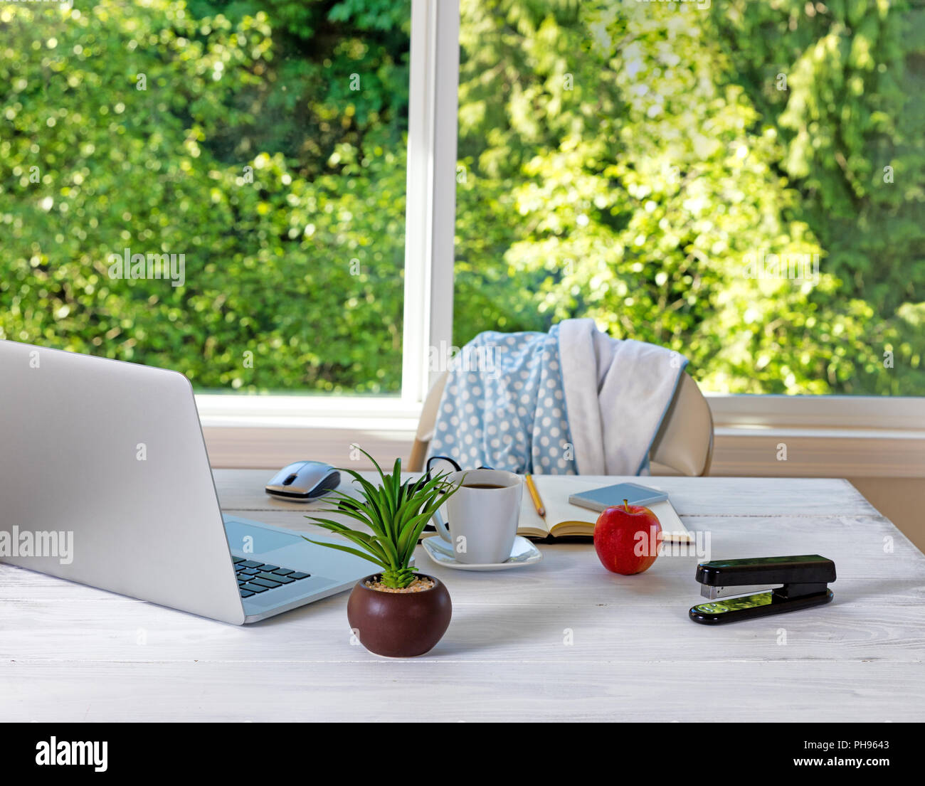 Front of desktop with bright daylight window in background Stock Photo ...