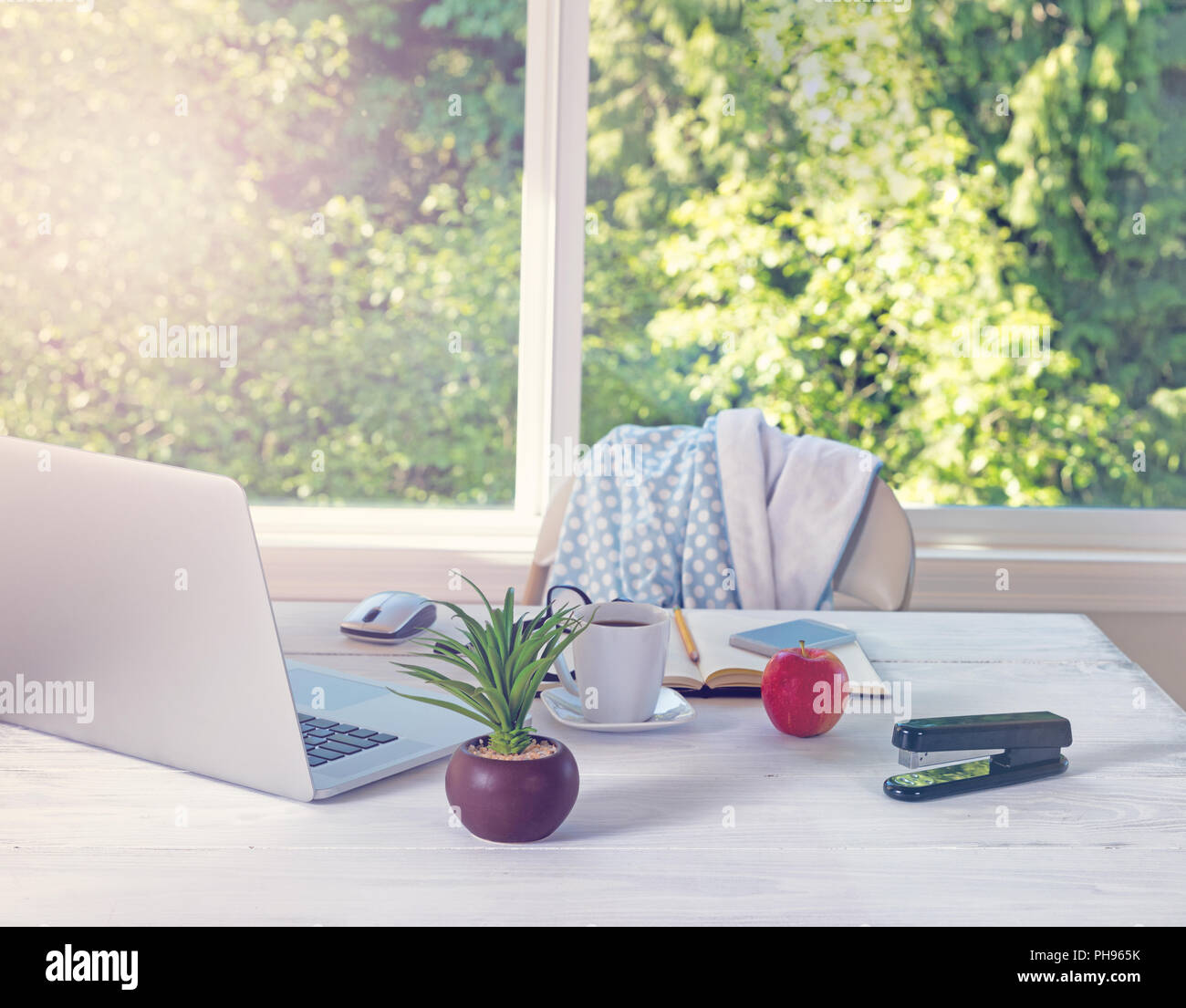 Front of desktop with bright daylight window in background Stock Photo ...