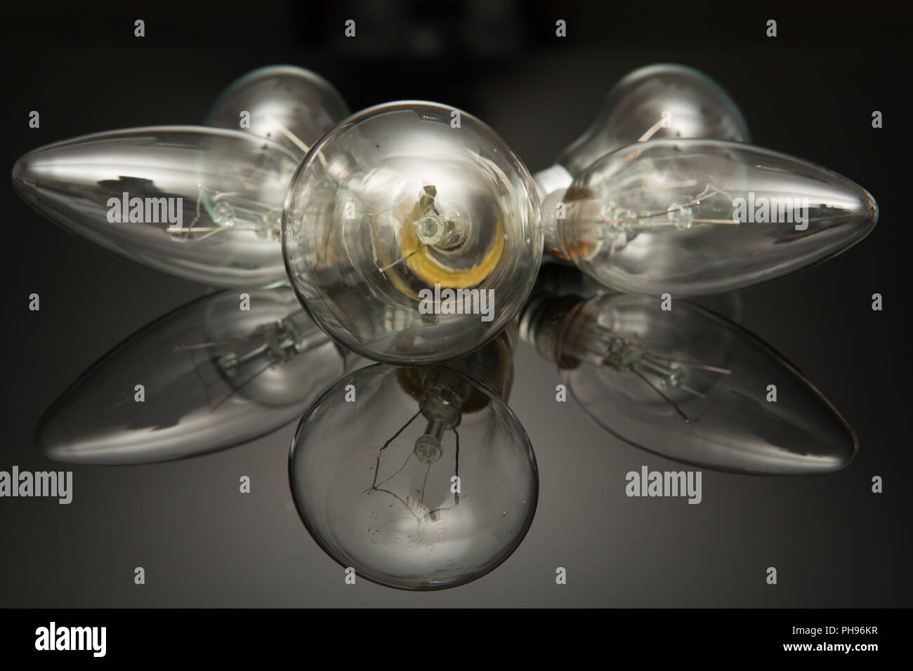 Light bulb on black background Stock Photo - Alamy