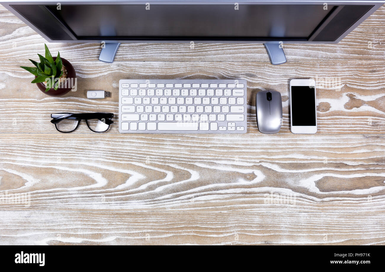 Top view of organized desktop on rustic white wood Stock Photo - Alamy