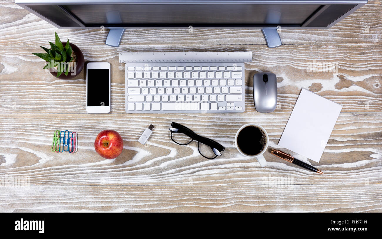 Top view of full desktop on rustic white wood Stock Photo - Alamy