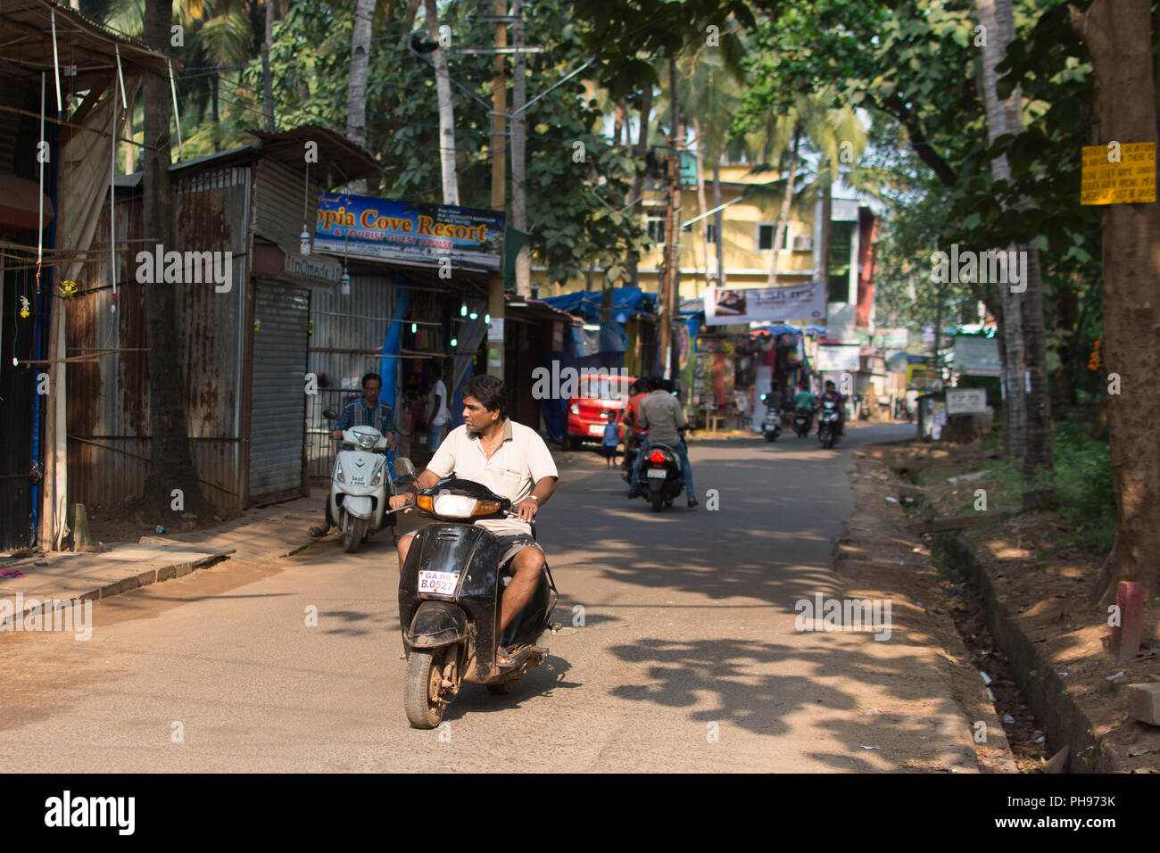 Goa, India - July 8, 2018 - Scooter on indian street in Goa passing ...