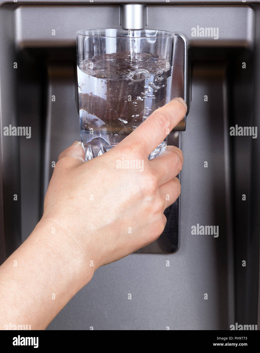 Drinking glass being filled up with filtered clean water Stock Photo ...