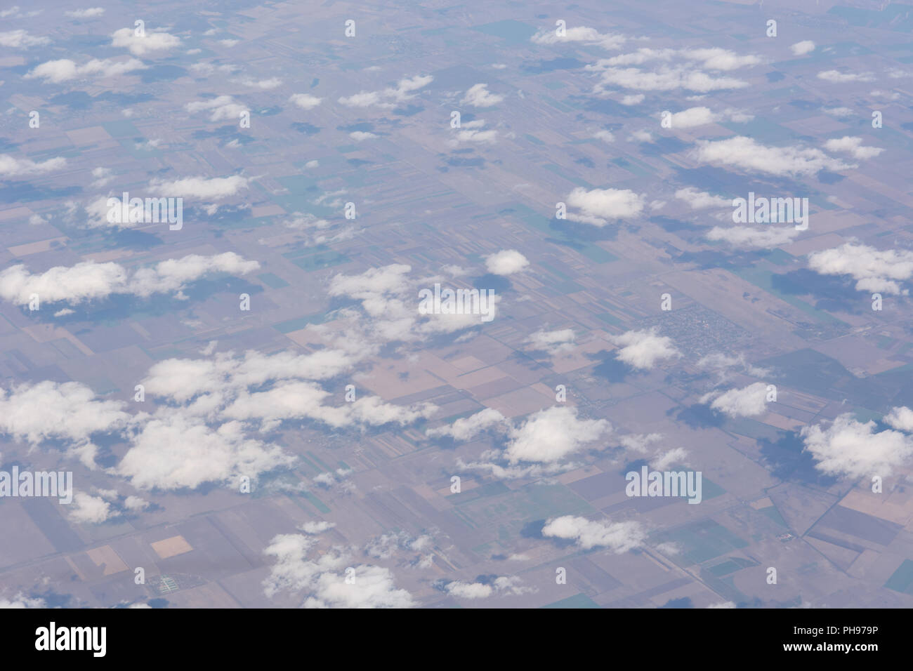 Goa, India - July 8, 2018 - Aerial view from plane on plain fields with ...