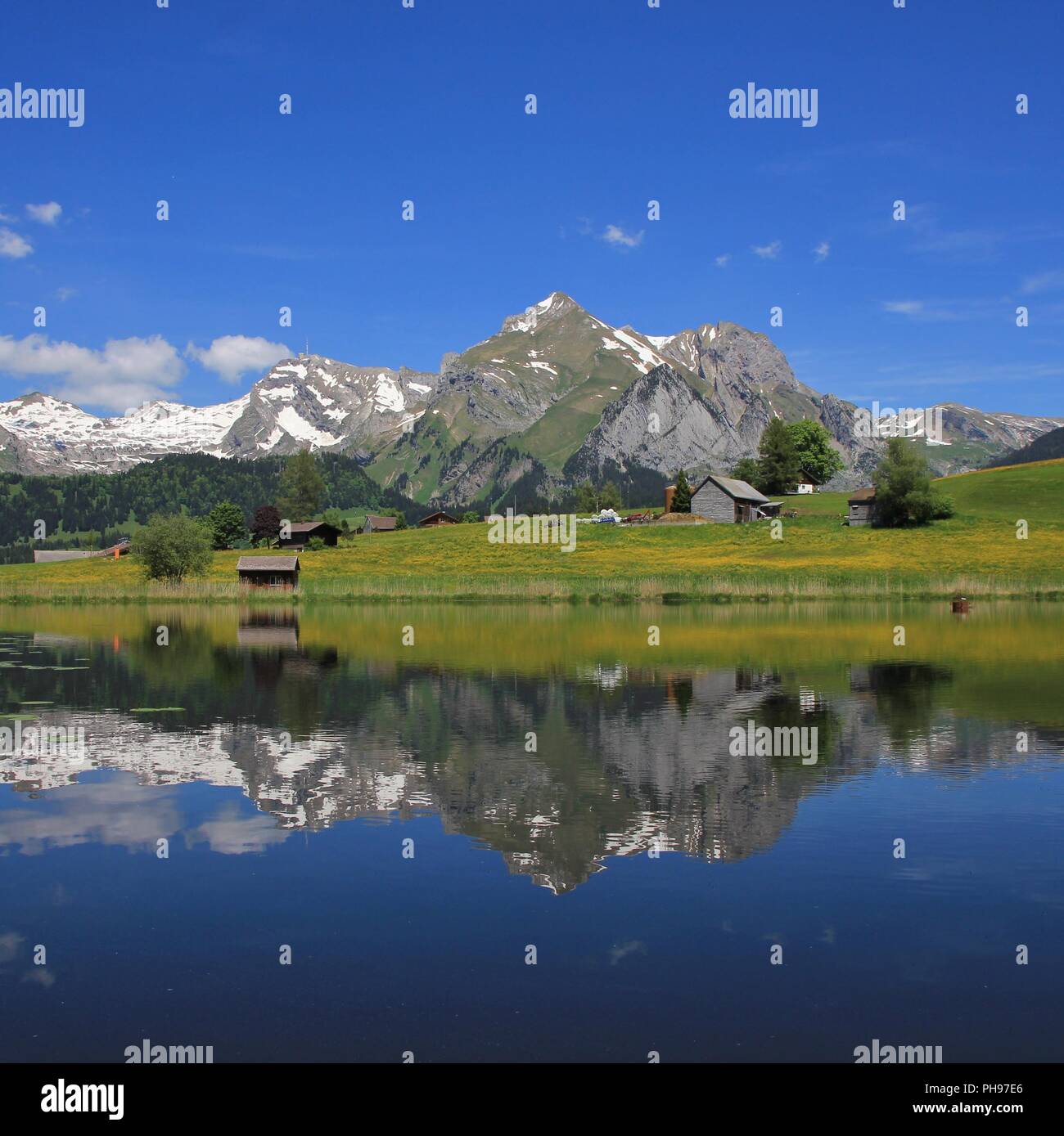 Mt Saentis and Alpstein range mirroring in lake Schwendisee Stock Photo ...