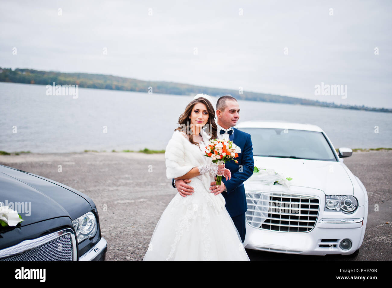 Wedding couple background two black and white wedding cars Stock Photo ...