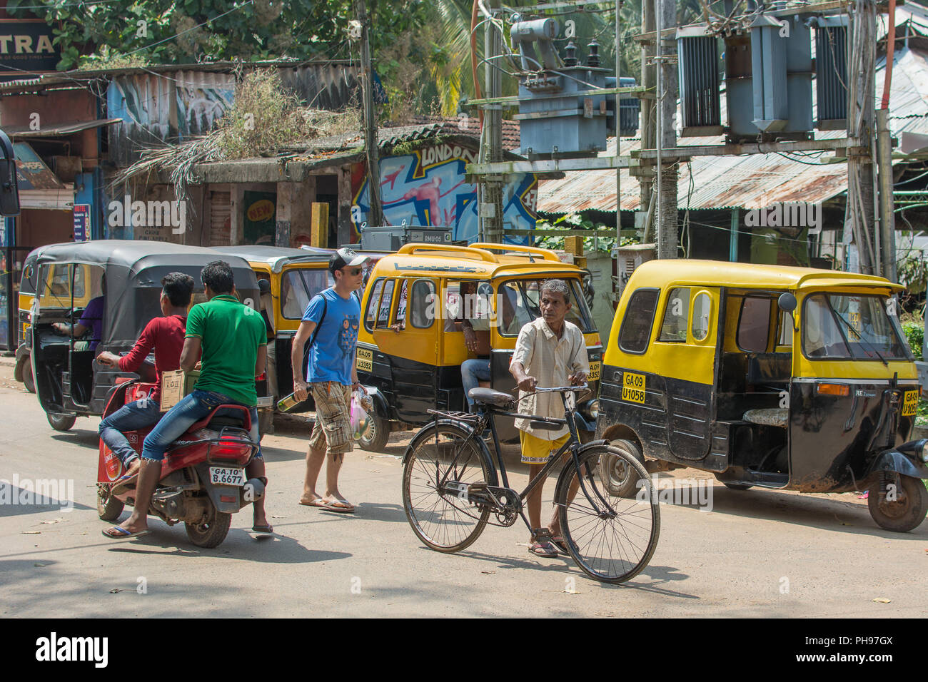 Goa, India - July 8, 2018 - Cyclist in typical traffic situation on ...