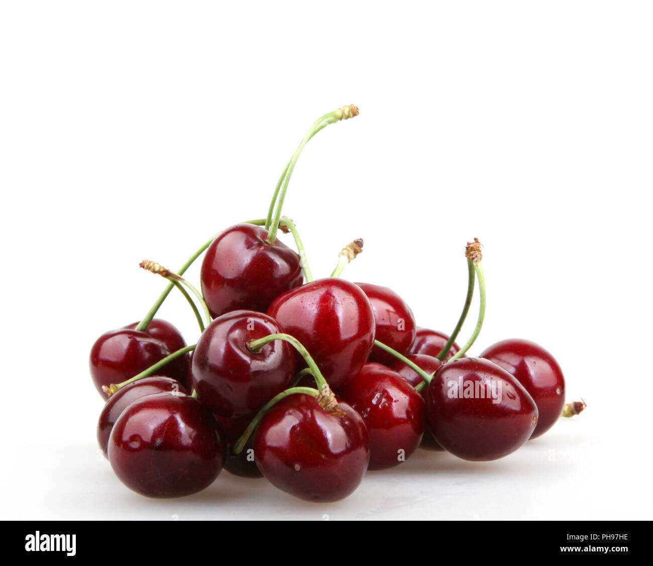 Sweet cherry isolated on white Stock Photo - Alamy