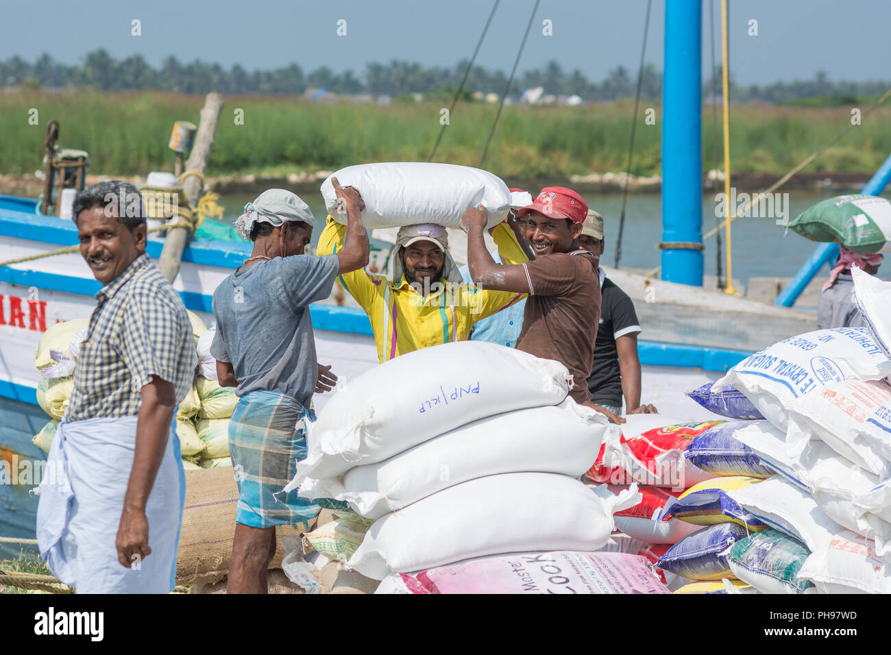 Carrying cement bags hi-res stock photography and images - Alamy