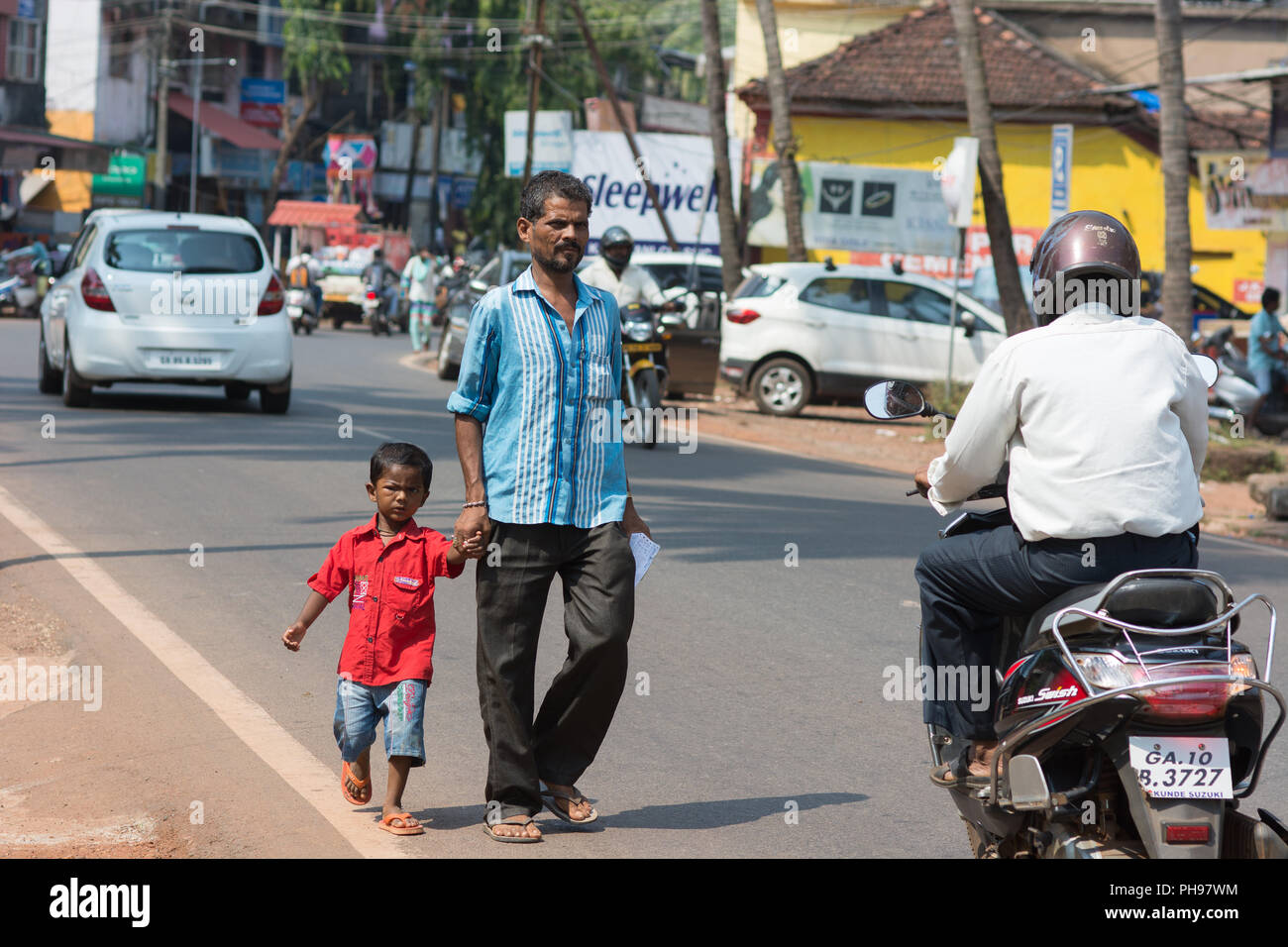 Indian boy on moped in street india hi-res stock photography and images ...